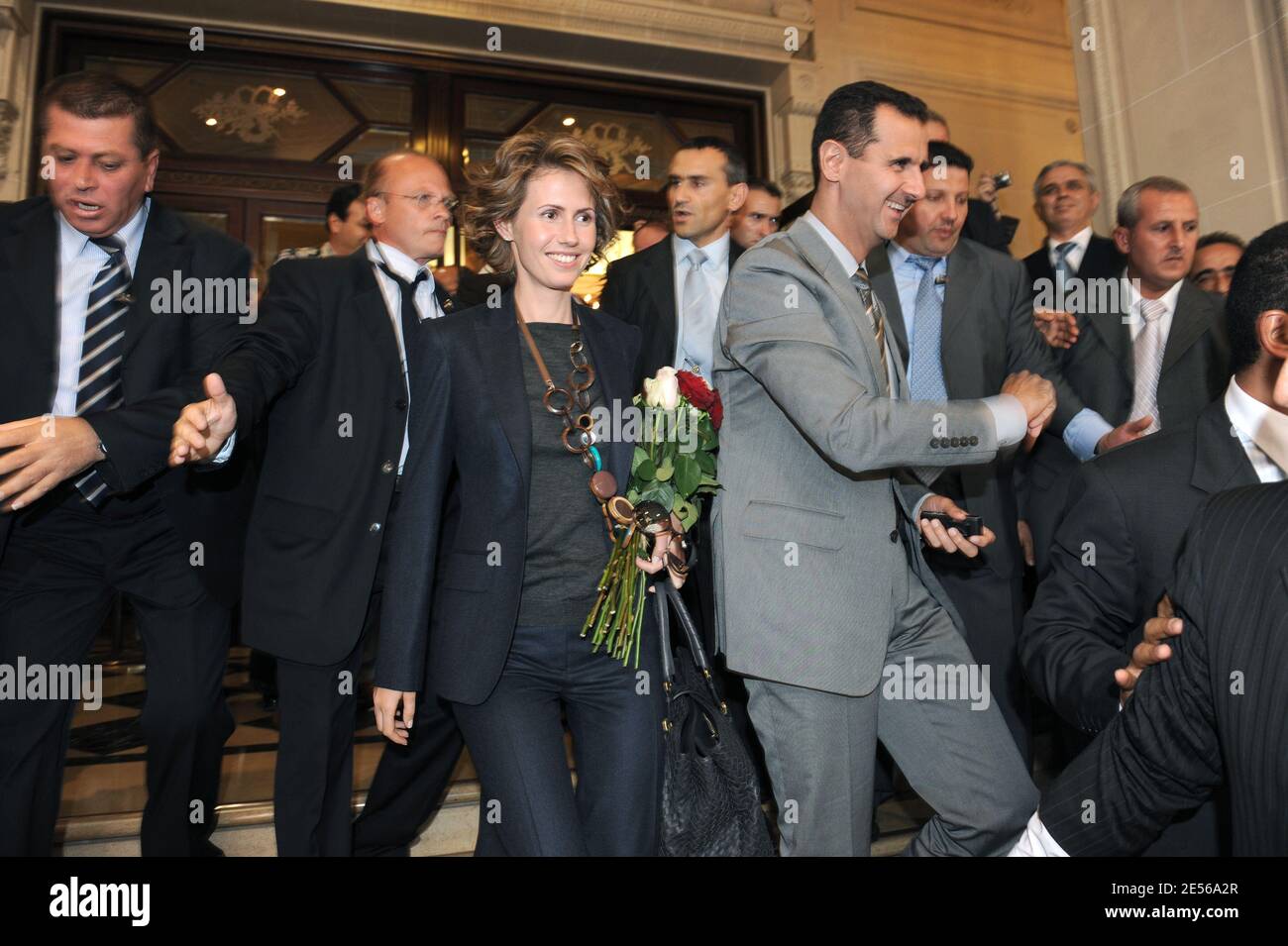 Syrian President Bashar Al Assad and wife Asma leave their residence ...