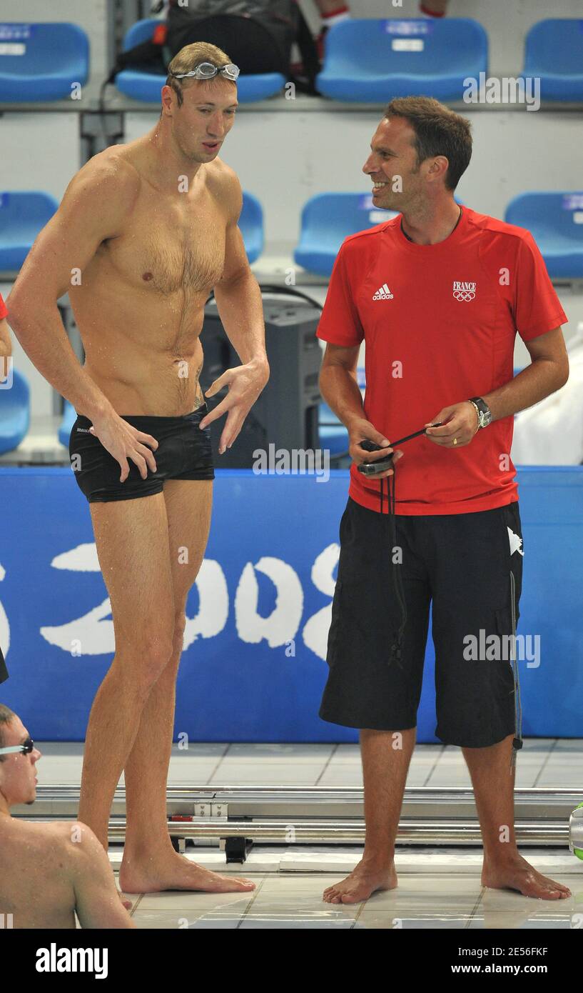 France's Alain Bernard with his coach Denis Auguin during a training ...