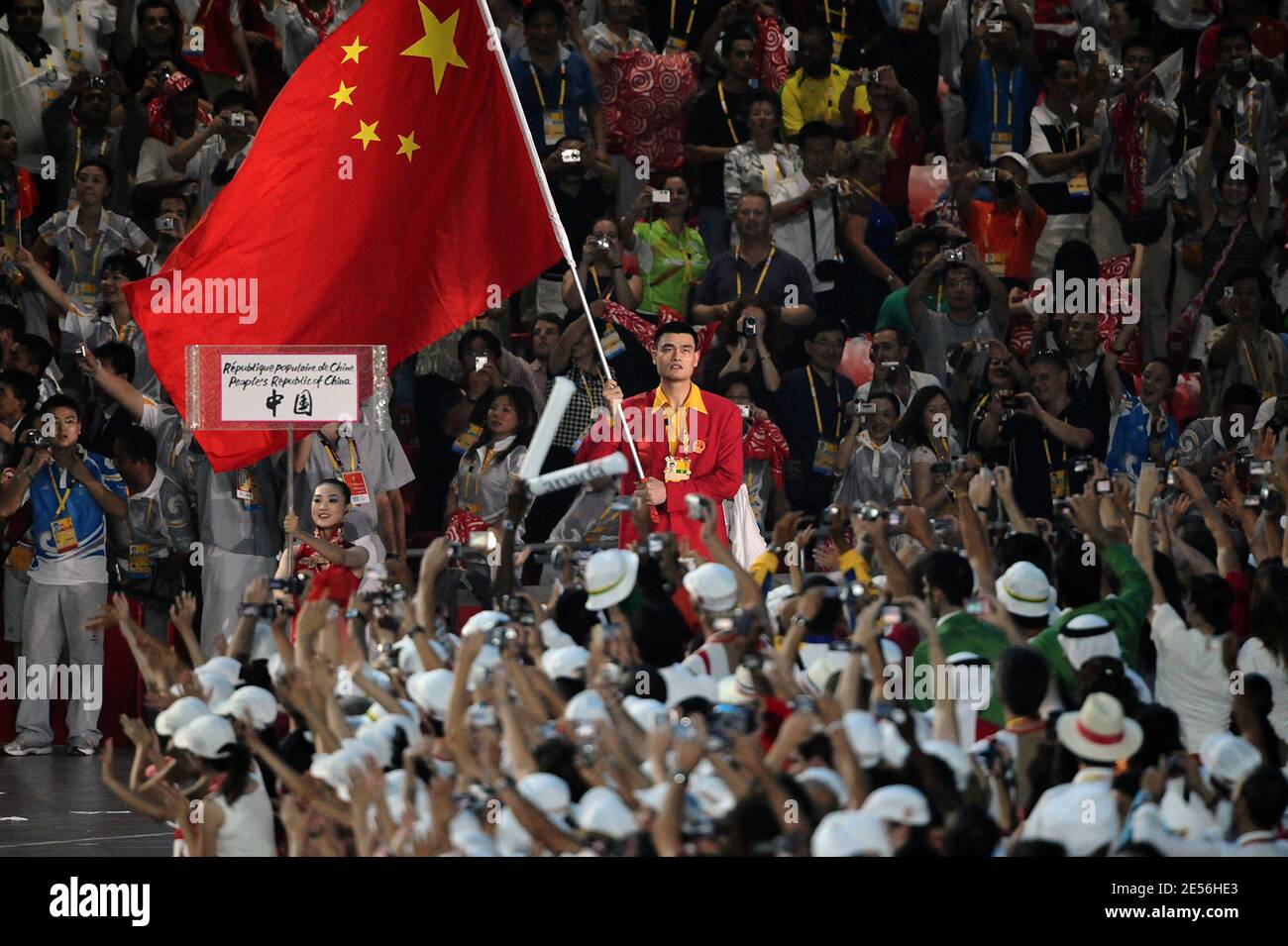 Yao Ming of China carries his country's flag during the Opening ...