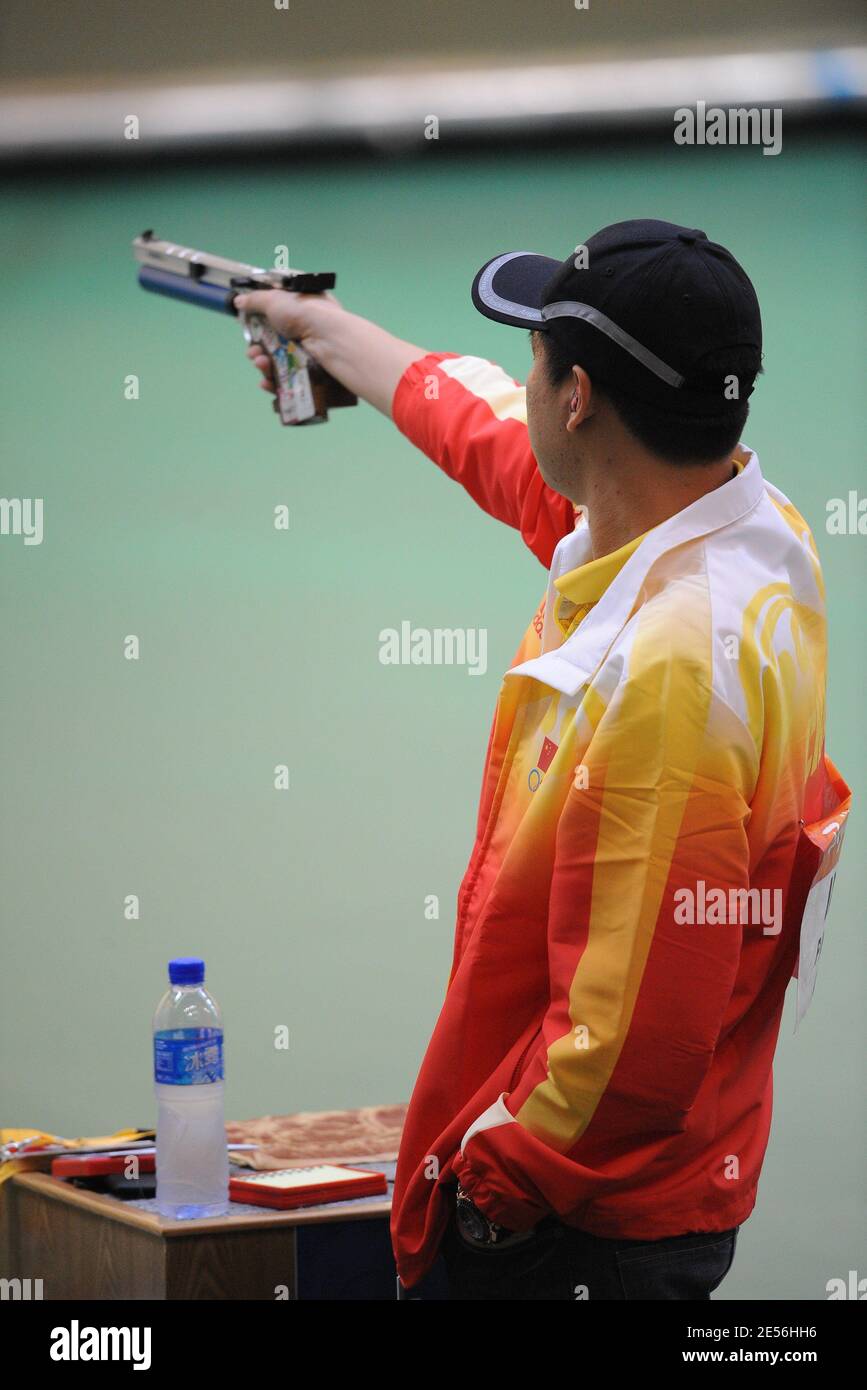 Pang Wei of China takes aim during the men's 10m Air Pistol Final of ...