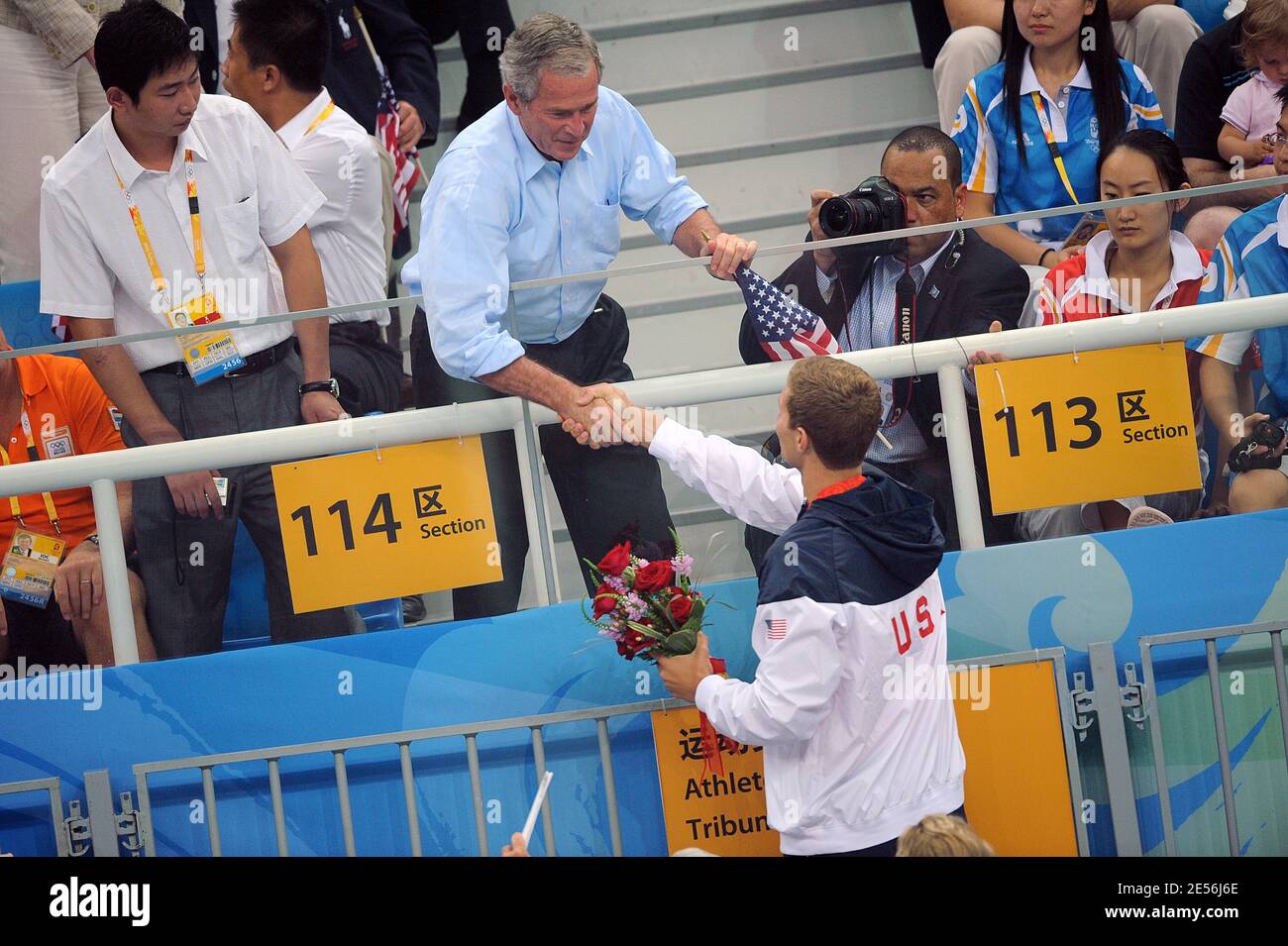 US president George W Bush and wife Laura shake hands with Olympic gold ...
