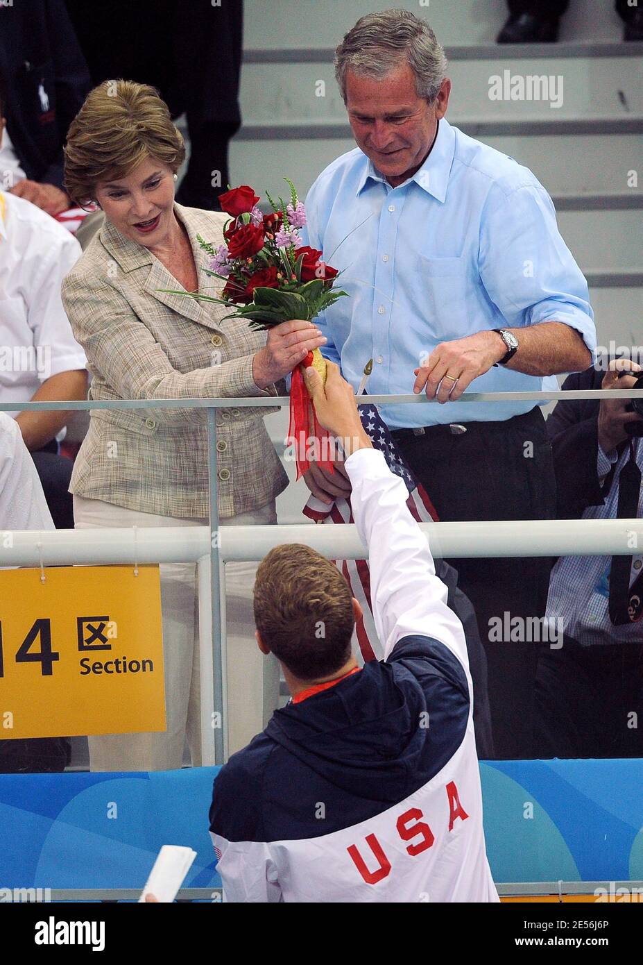 US president George W Bush and wife Laura shake hands with Olympic gold ...