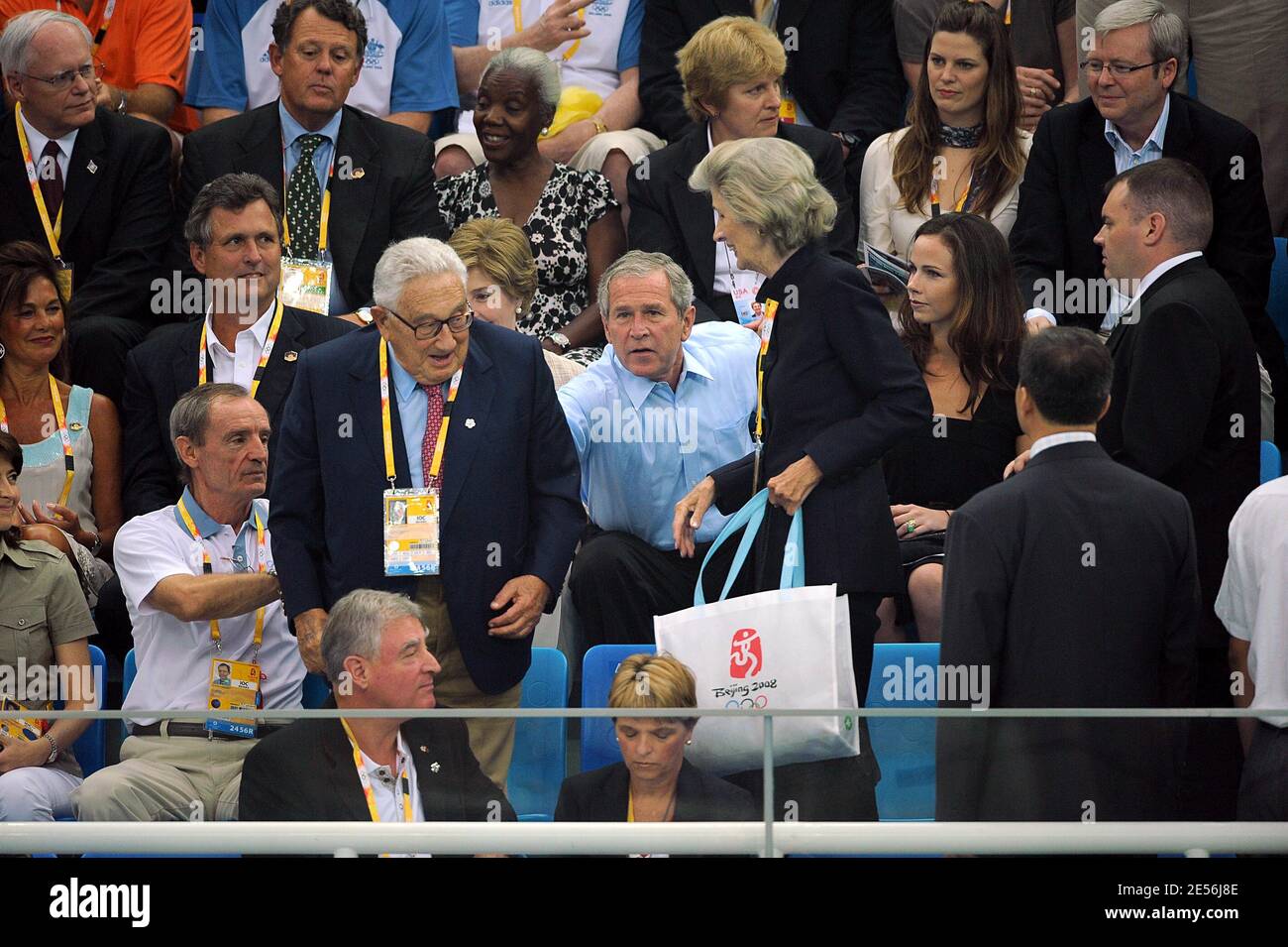 US president George W Bush shakes hands with former National Security ...