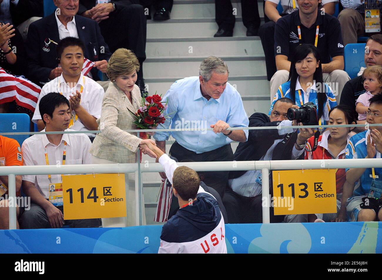 US president George W Bush and wife Laura shake hands with Olympic gold ...