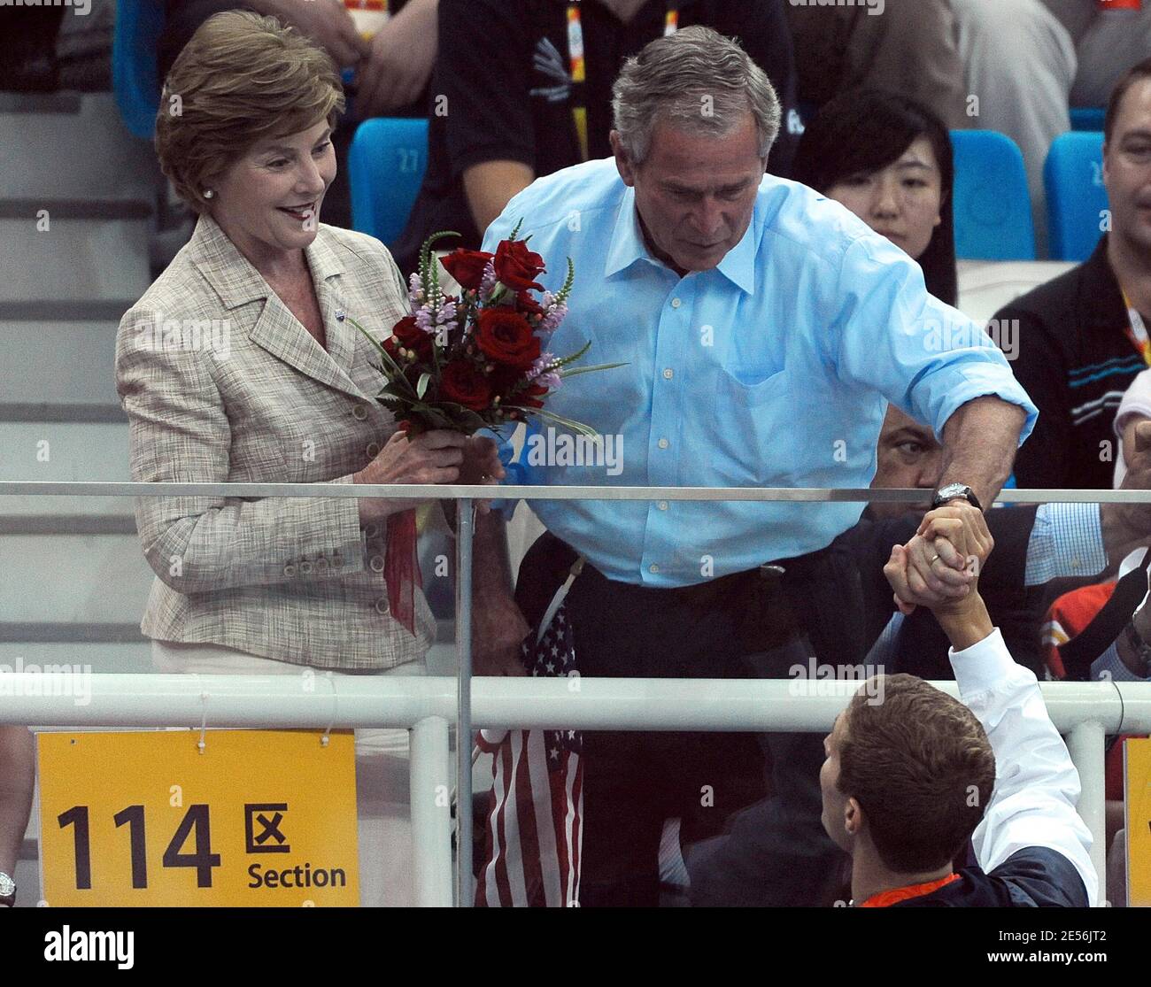US President George W Bush and wife Laura shake hands with Olympic gold ...