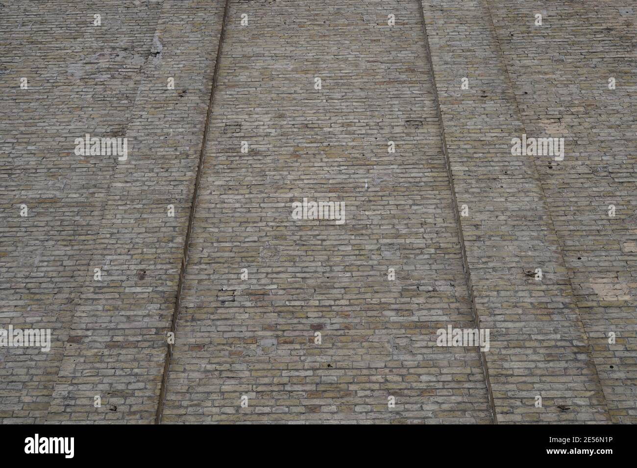 Old brick wall with defects and cracks in perspective Stock Photo - Alamy