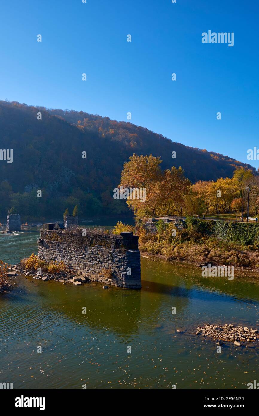 A fall, autumn view of an old stone Bollman bridge pylon foundation. At ...