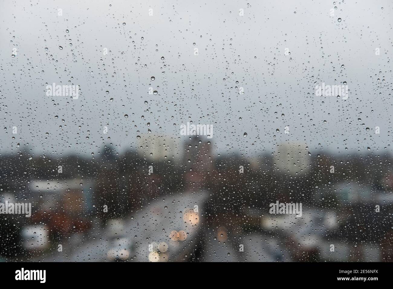 City view through rain window hi-res stock photography and images - Alamy