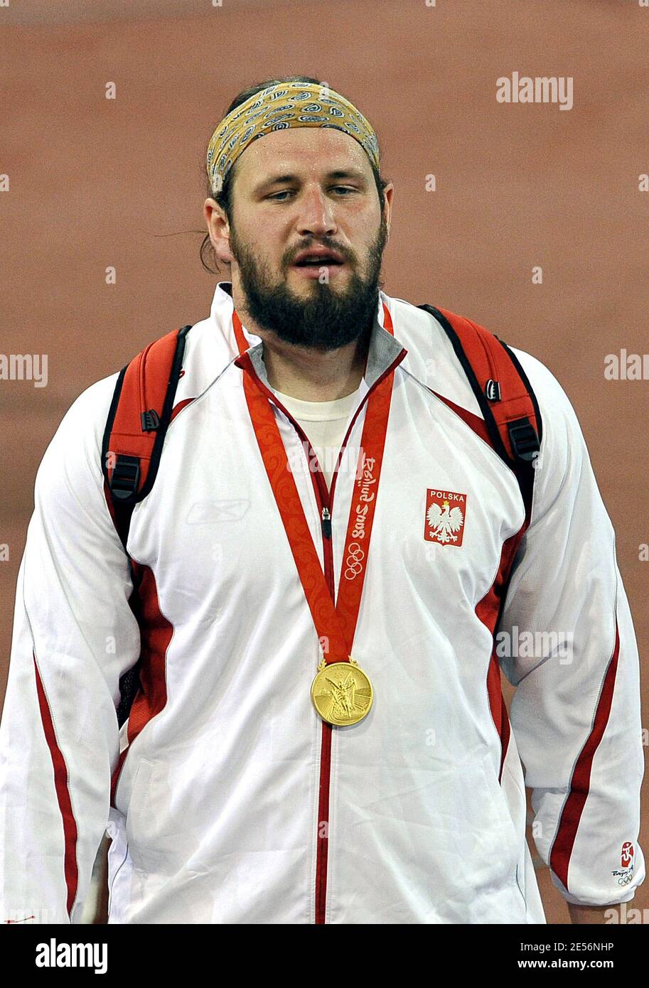 Poland's Tomasz Majewski celebrates taking gold in the men's shot put ...