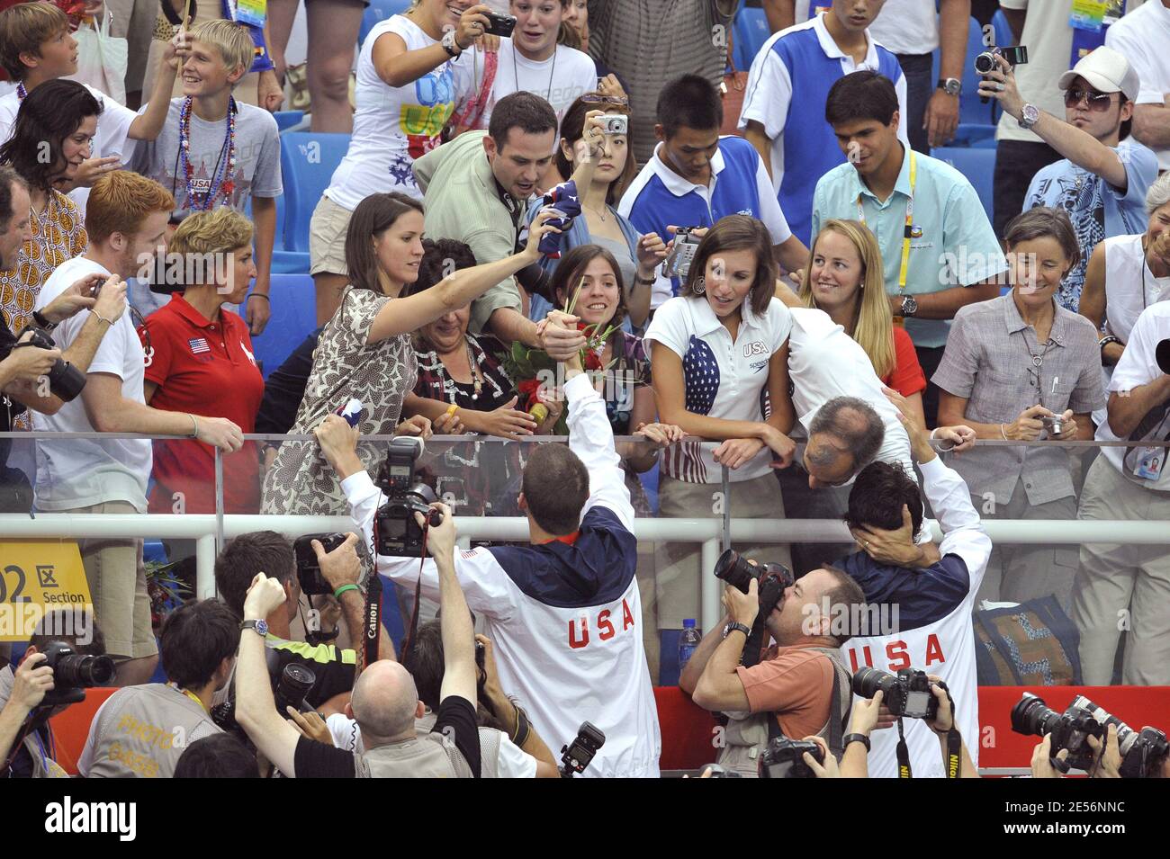 Deborah Phelps kisses her son Michael Phelps after the men's 4x200m ...