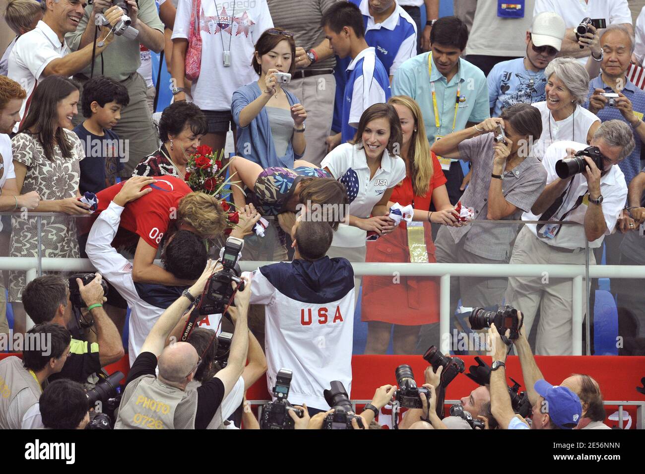 Deborah Phelps kisses her son Michael Phelps after the men's 4x200m ...