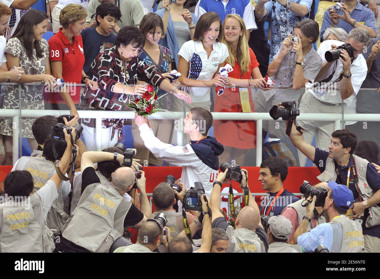 Deborah Phelps kisses her son Michael Phelps after the men's 4x200m ...
