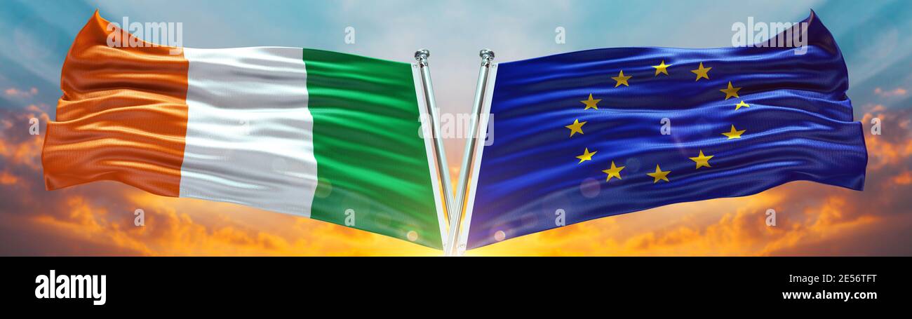 European Union Flag and Ireland flag waving with texture sky Cloud and ...