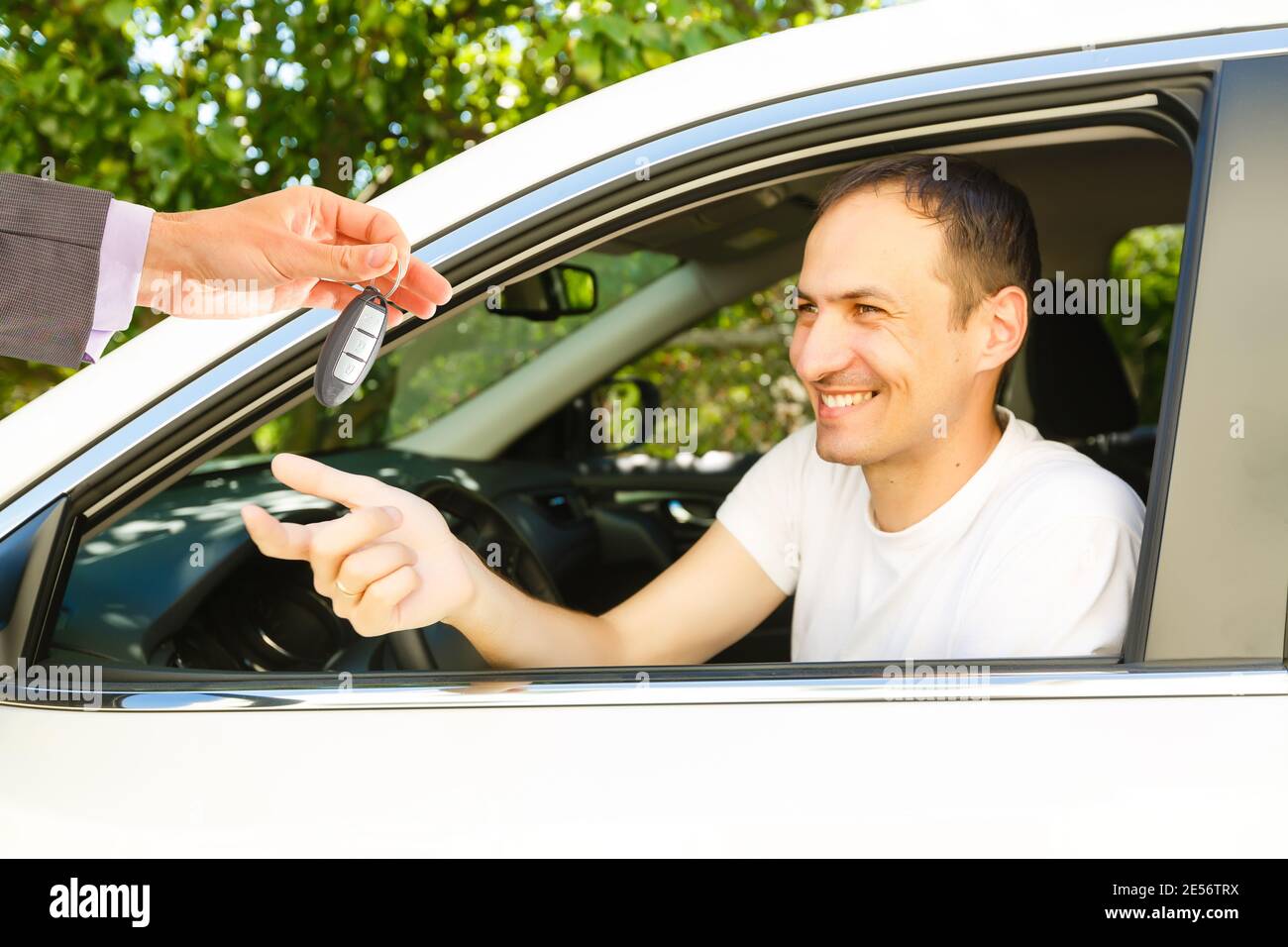 Portrait of an handsome guy driving his car Stock Photo - Alamy