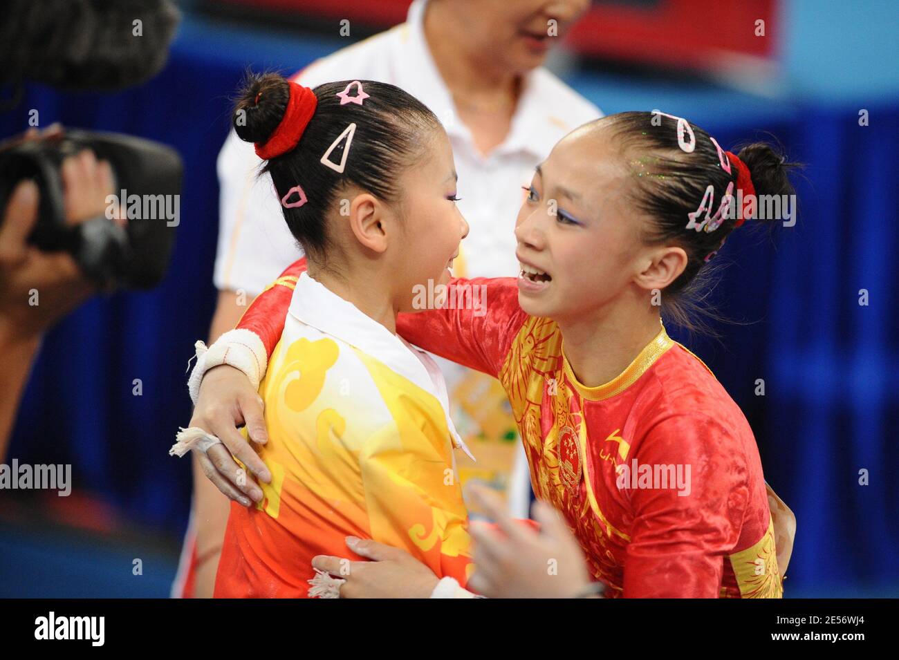 China's Hexin He and Yilin Yang celebrate their Gold and Bronze medal after the Women's Uneven ...
