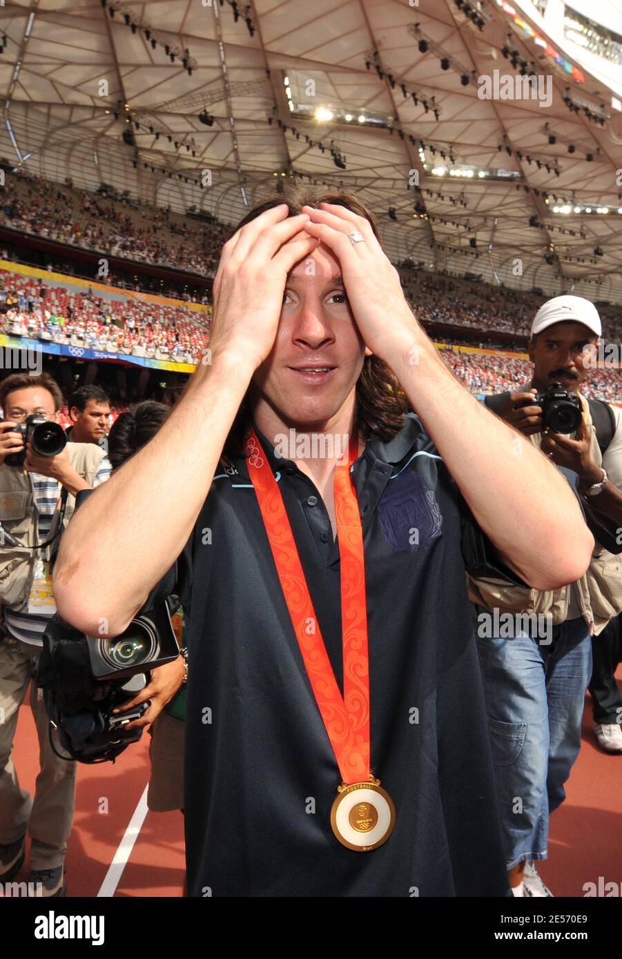 Argentina's Lionel Messi celebrates with his gold medal after the Men's ...