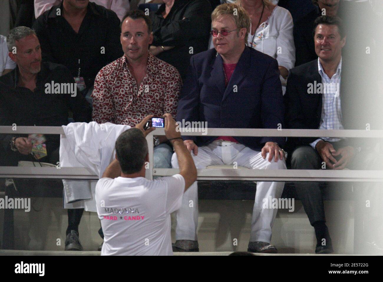 Elton John and husband David Furnish attend the Madonna's concert held ...