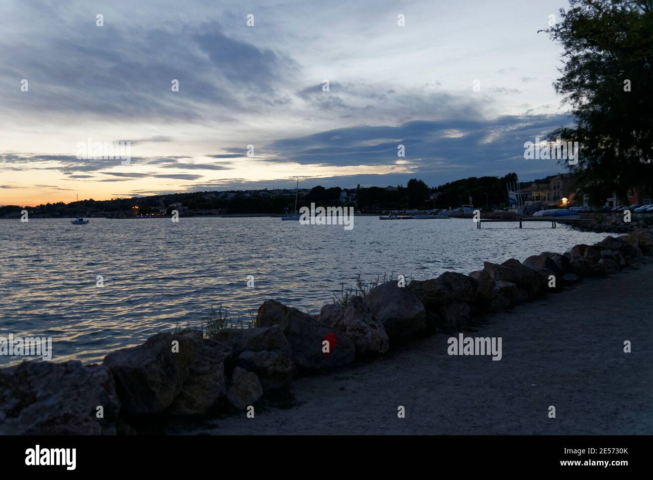 Bouzigues, France. 24th Aug, 2014. Sailboats by night on The Thau ...