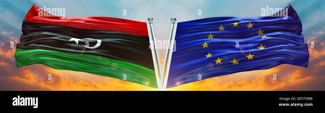 European Union Flag and Libya flag waving with texture sky Cloud and ...