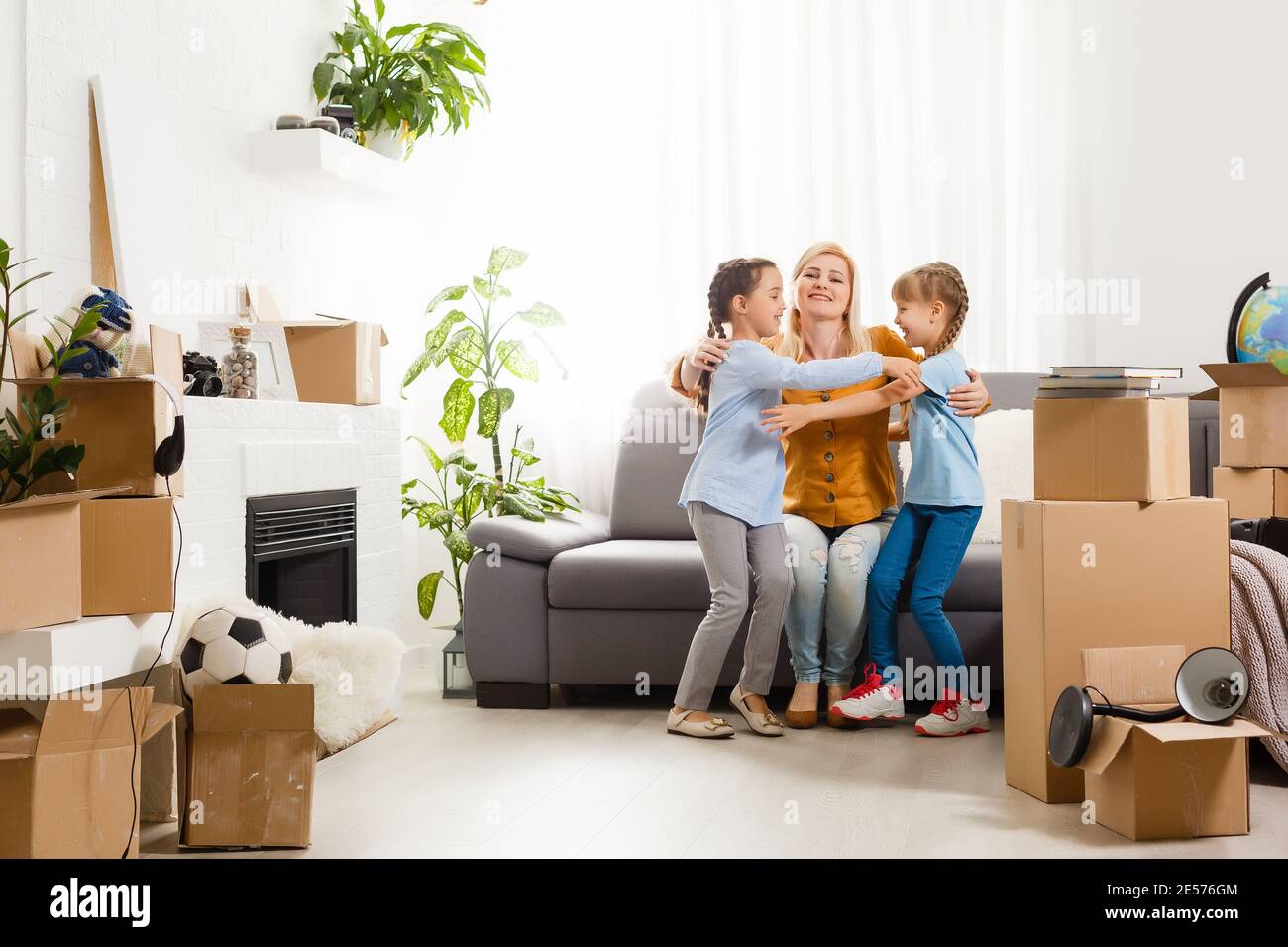 Little girl moving into new house, near cardboard box Stock Photo - Alamy