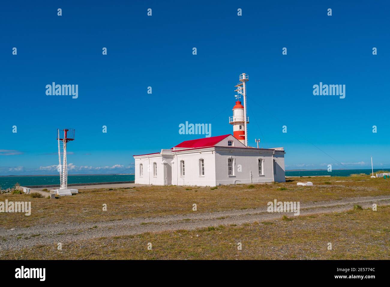 Lighthouse at Strait of Magellan, Punta Delgada, near a ferry into ...