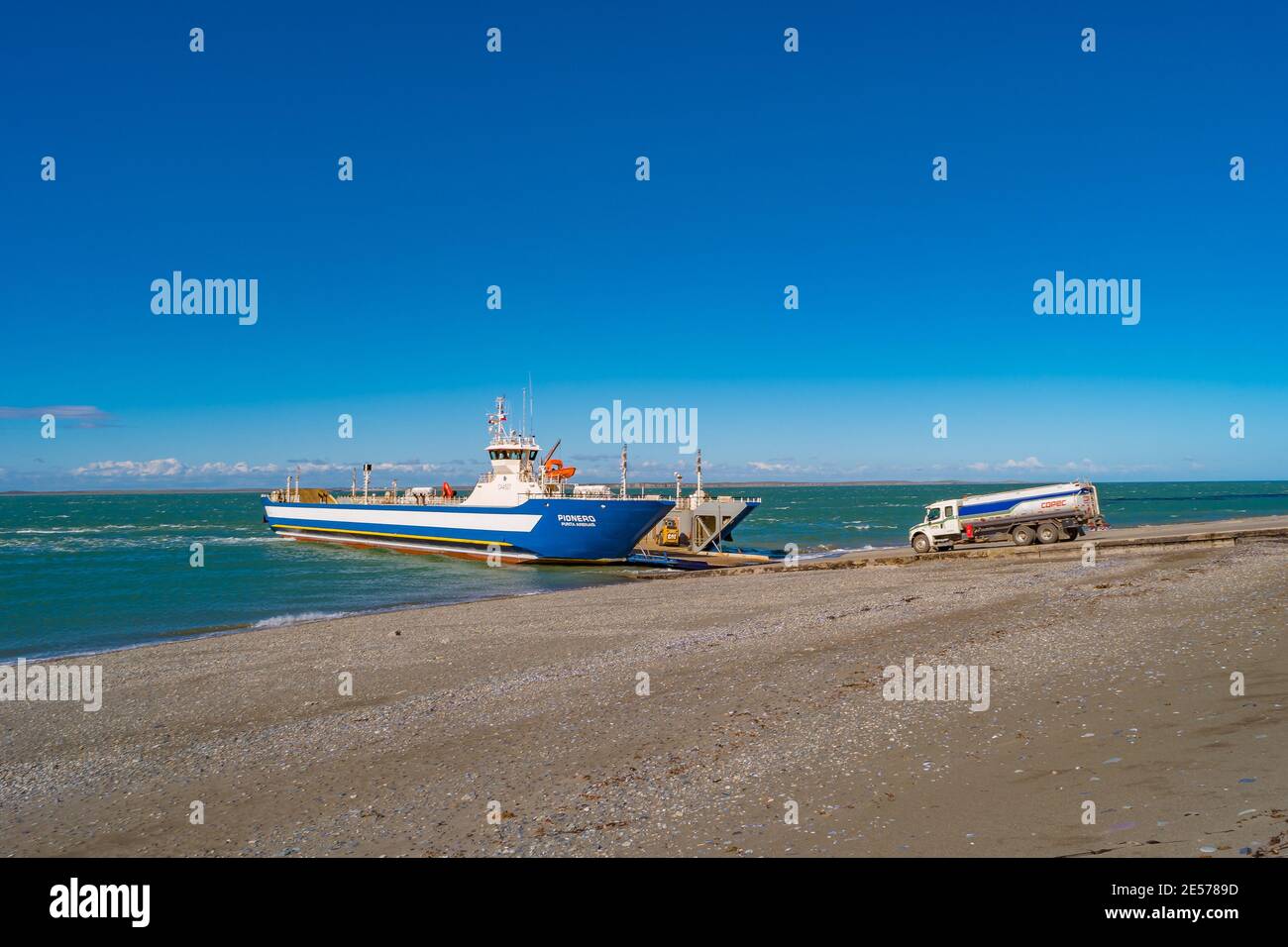Ferry boat is loaded with cargo cars and tourist buses to cross Strait ...