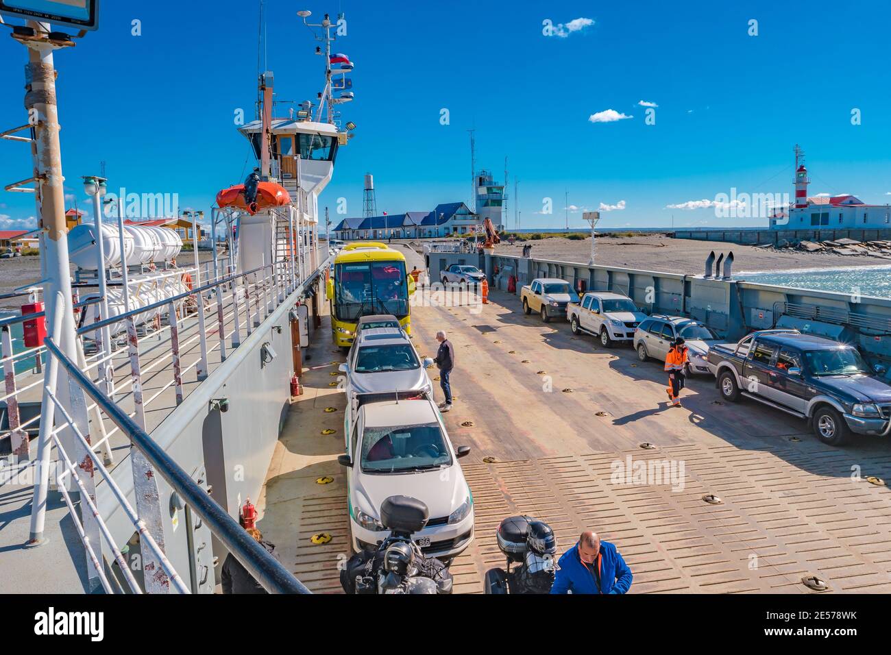 Ferry boat is loaded with cargo cars and tourist buses to cross Strait ...