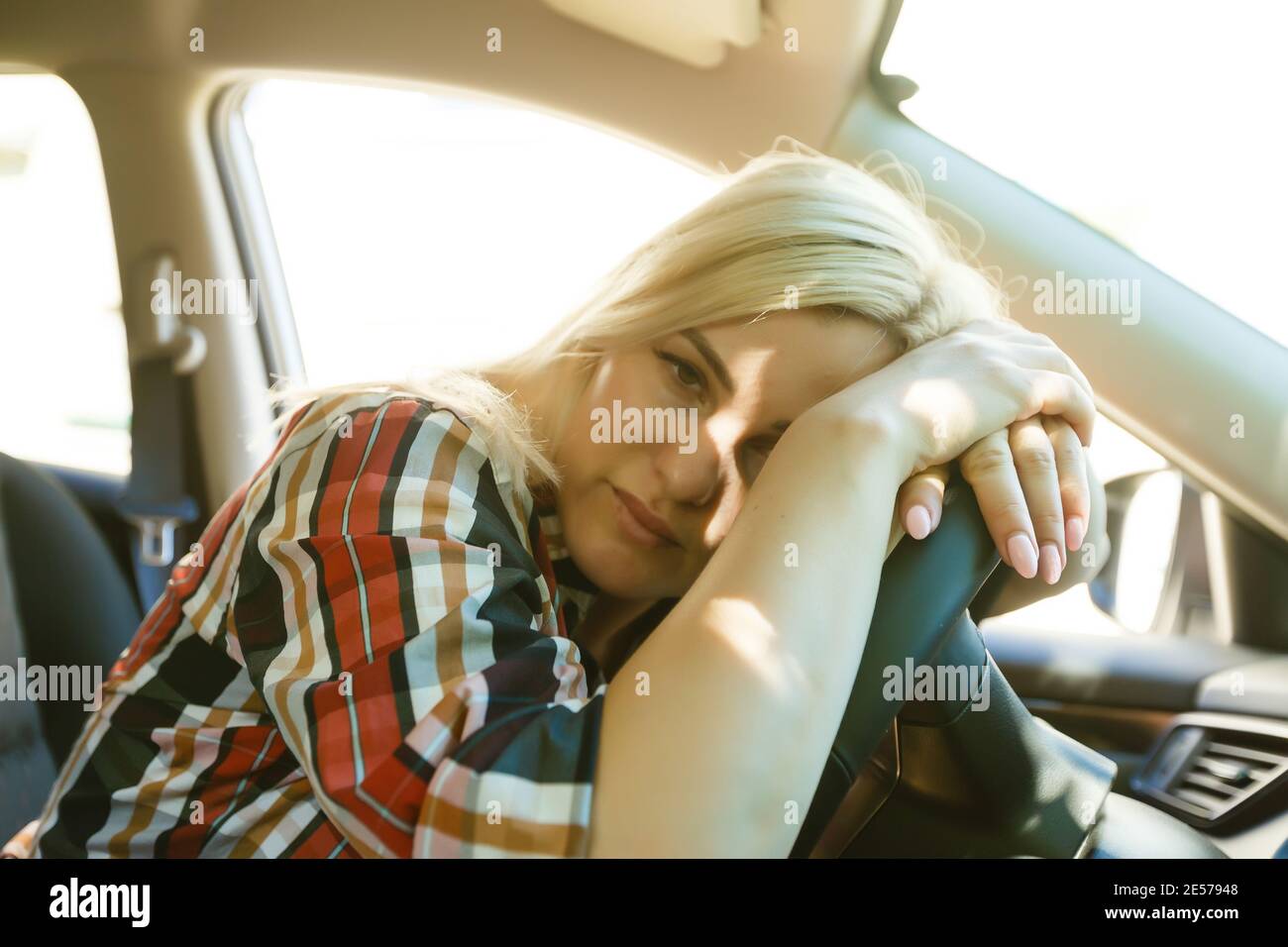 Stressed woman driver sitting inside her car Stock Photo - Alamy