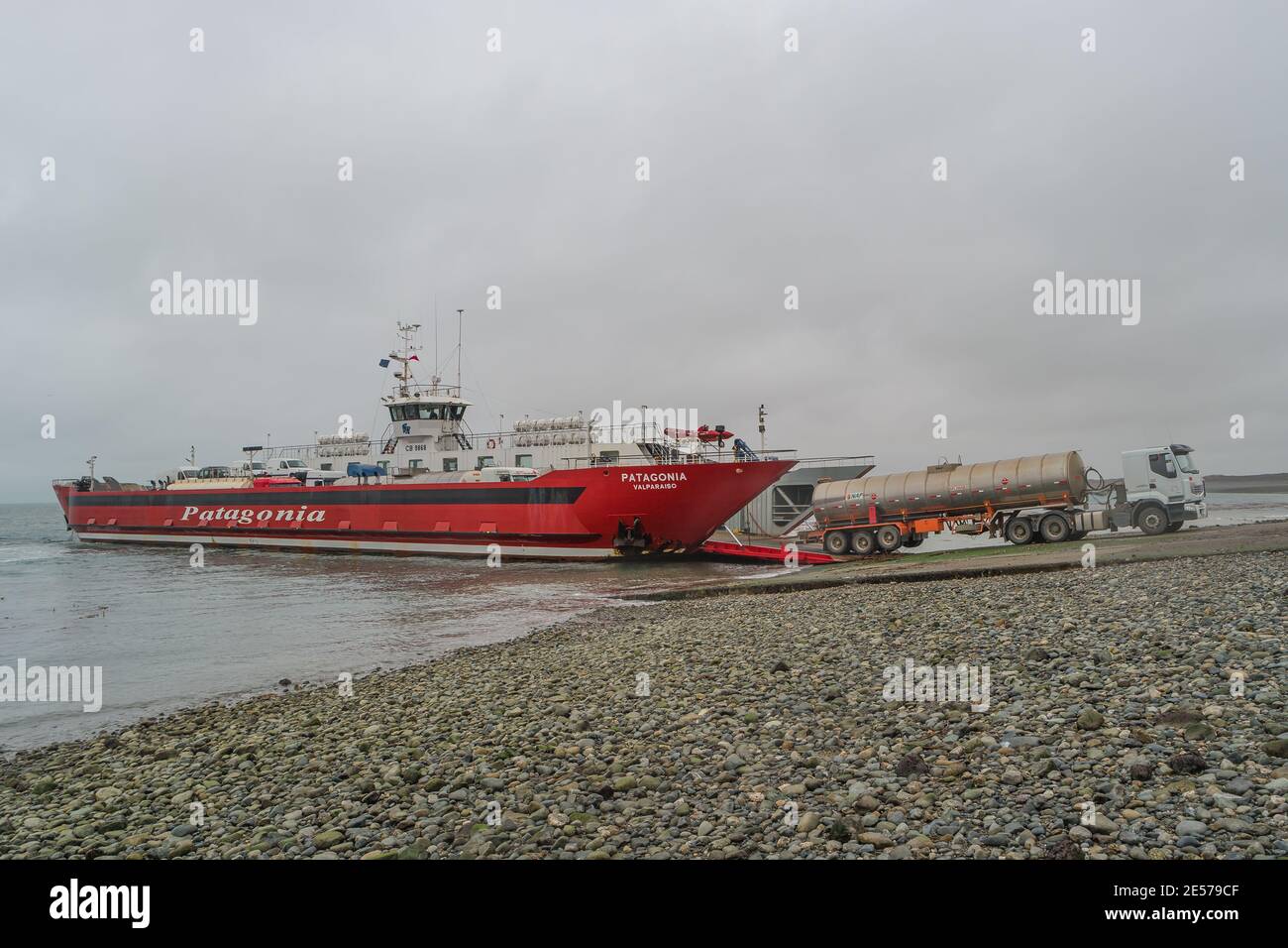 Ferry boat is loaded with cargo cars and tourist buses to cross Strait ...