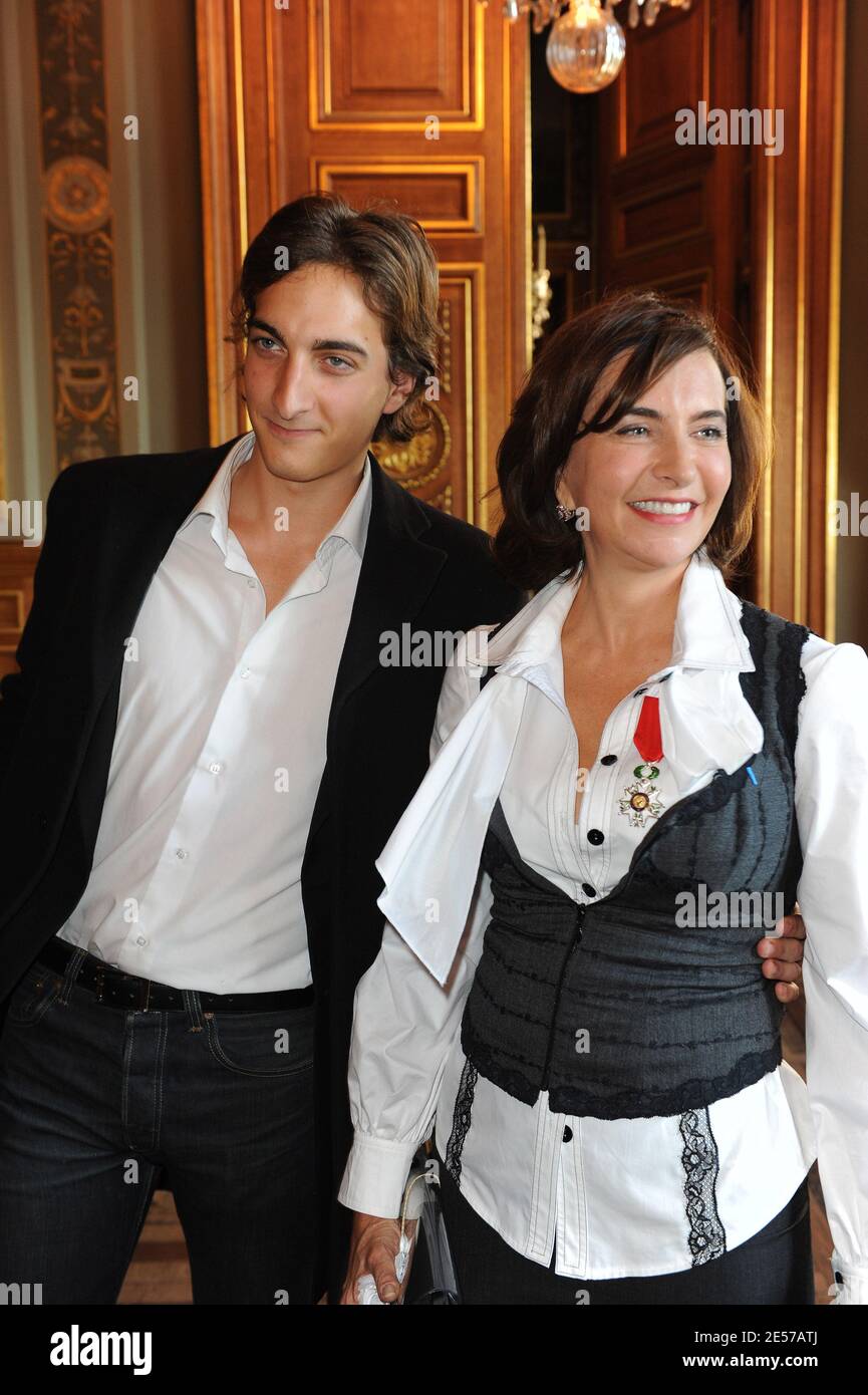 French fashion designer Nathalie Garcon poses with her son after she ...