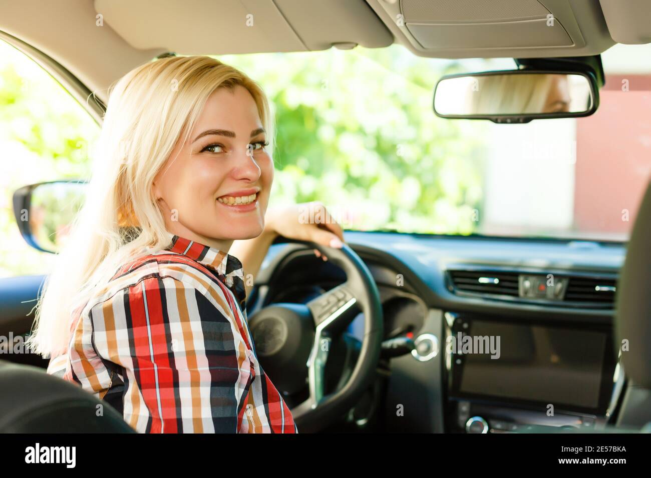 Young woman driving her car Stock Photo - Alamy