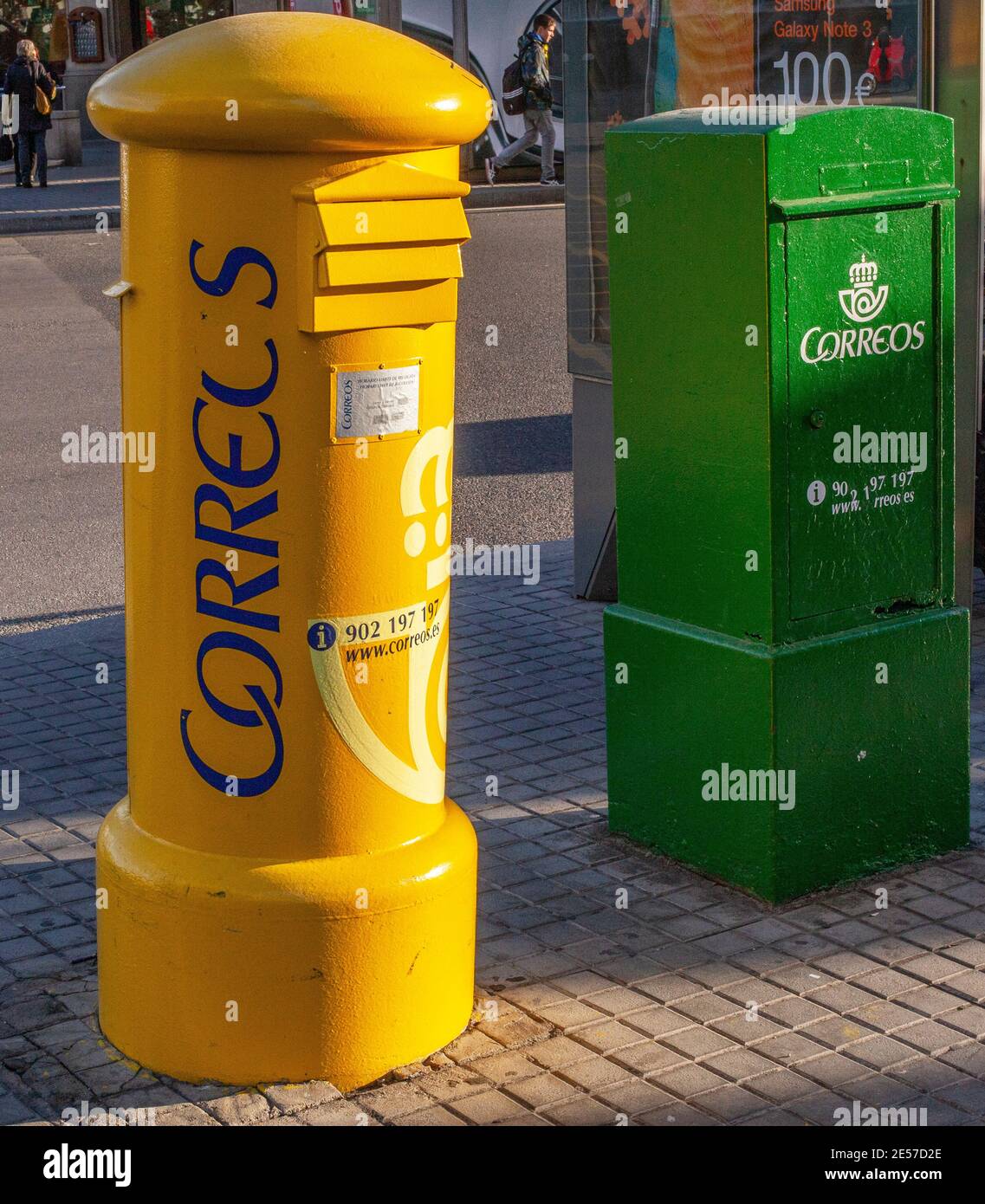 Central Barcelona, Catalonia, Spain; yellow and green post-boxes in the ...