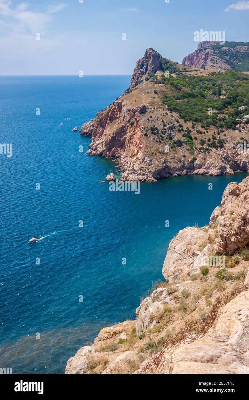 Summer view seacoast. Warm sea and beautiful nature. Sudak beach. Black ...