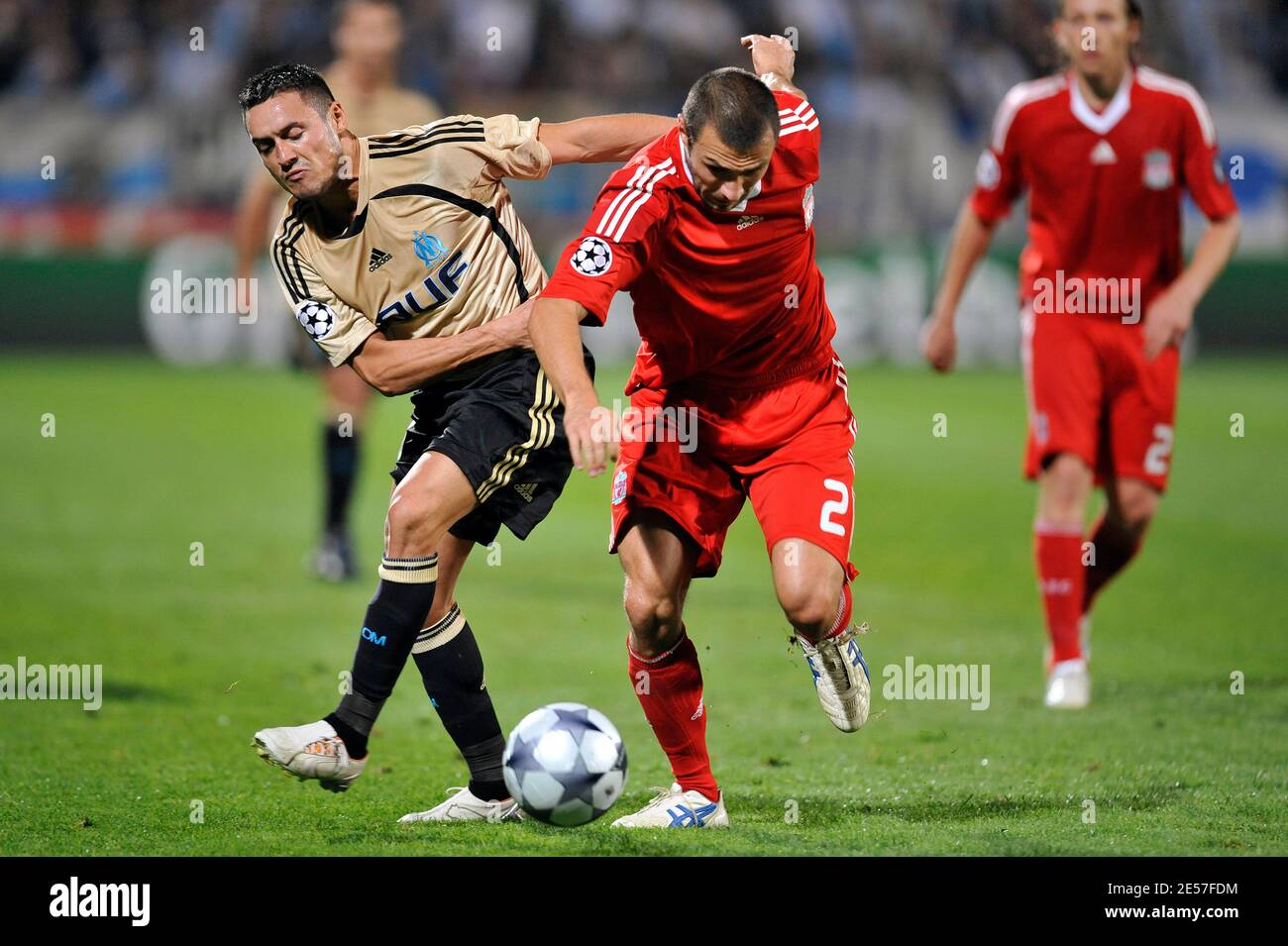Marseille's Karim Ziani and Liverpool's Andrea Dossena during the UEFA ...
