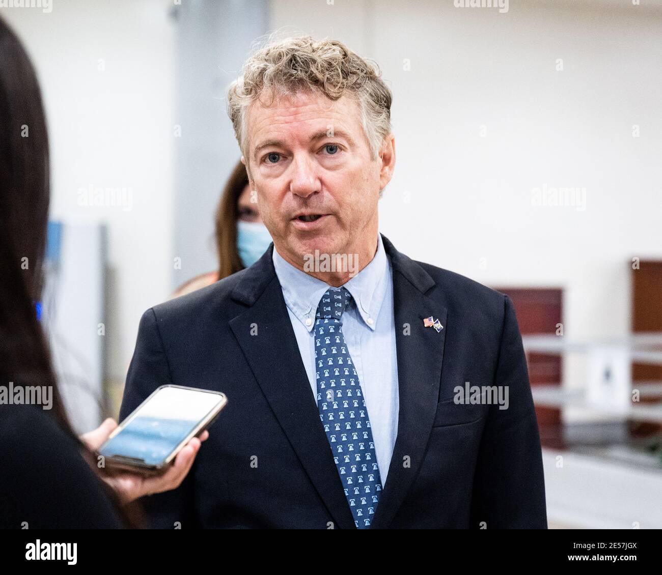 Senator Rand Paul (R-KY) talking with a reporter near the Senate Subway ...