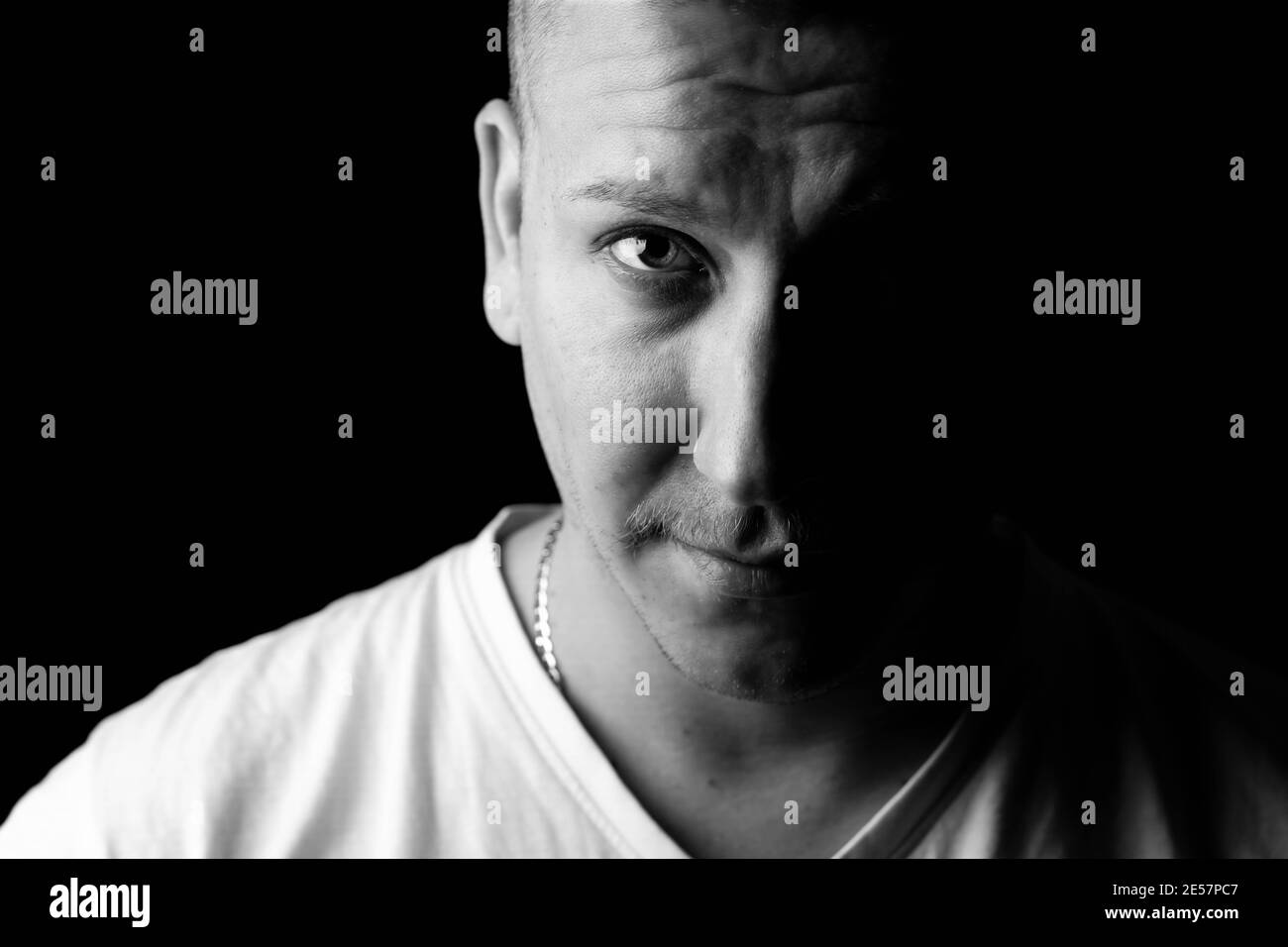 Close-up black and white portrait of a strong, confident male person ...