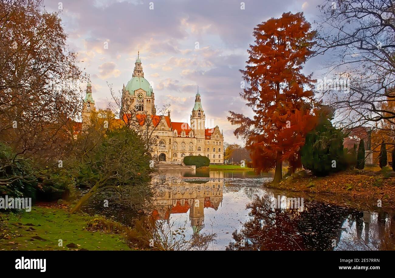 The bright red and yellow autumn trees in Maschpark with a view on ...