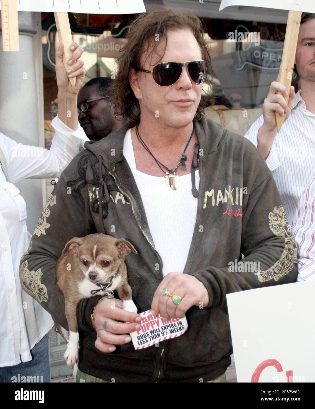 Mickey Rourke leads a rally outside Hot Dog Puppies in South Beach, Fl ...