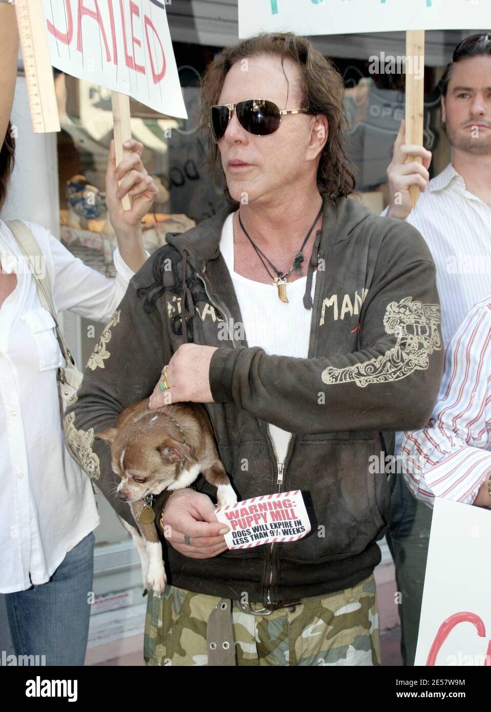 Mickey Rourke leads a rally outside Hot Dog Puppies in South Beach, Fl ...