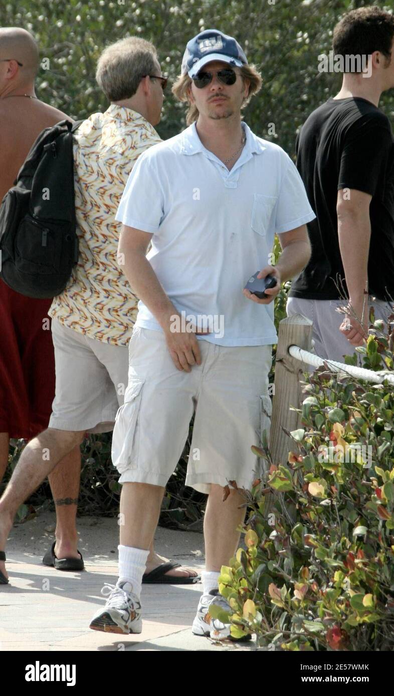 Comedian David Spade plays up to the camera as he enjoys a walk in the ...