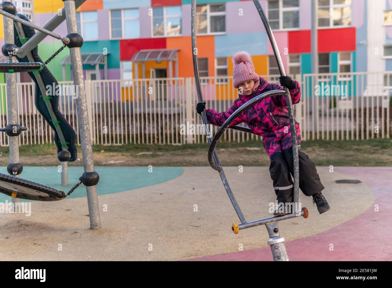 Playground, a child plays on a spinning pipe, in the entertainment ...