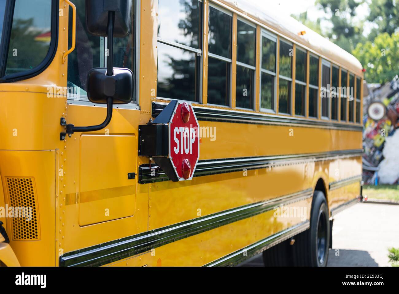 Yellow school bus on the street Stock Photo - Alamy