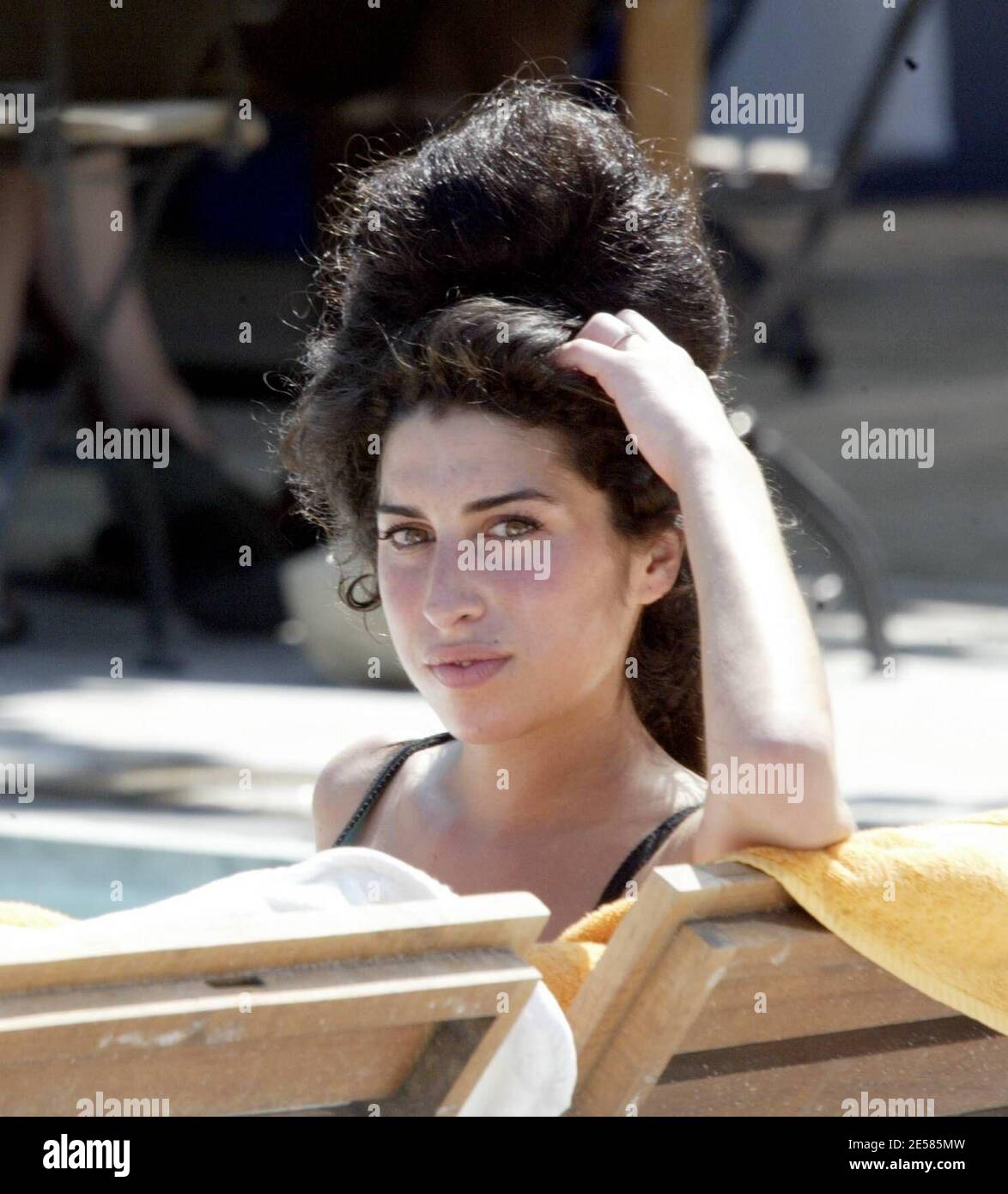 "Rehab" singer Amy Winehouse displayed her tattoos and scars in a ...