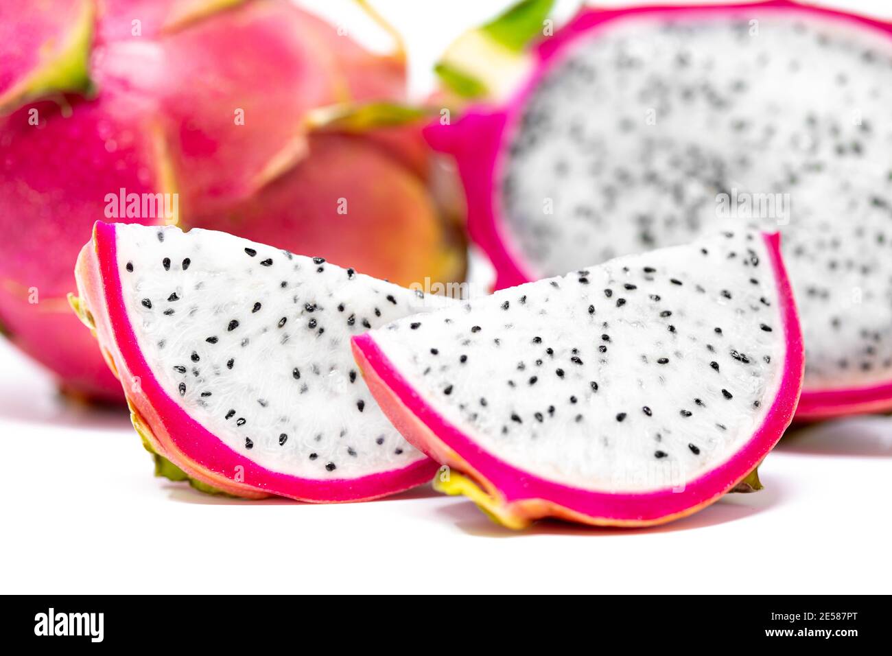 Fresh whole and sliced dragonfruit isolated on white background close ...