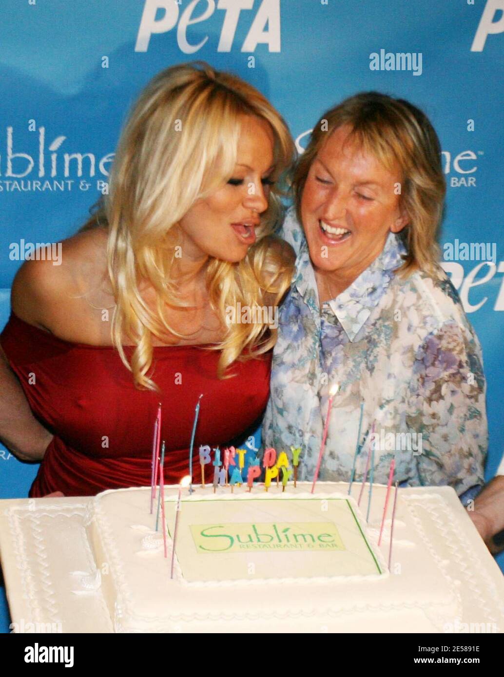 Pamela Anderson blows out the candles for her 40th with PETA president ...