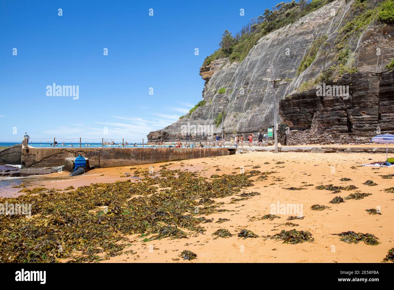 Bilgola Beach in Sydney with rock fall netting above the beach ocean ...