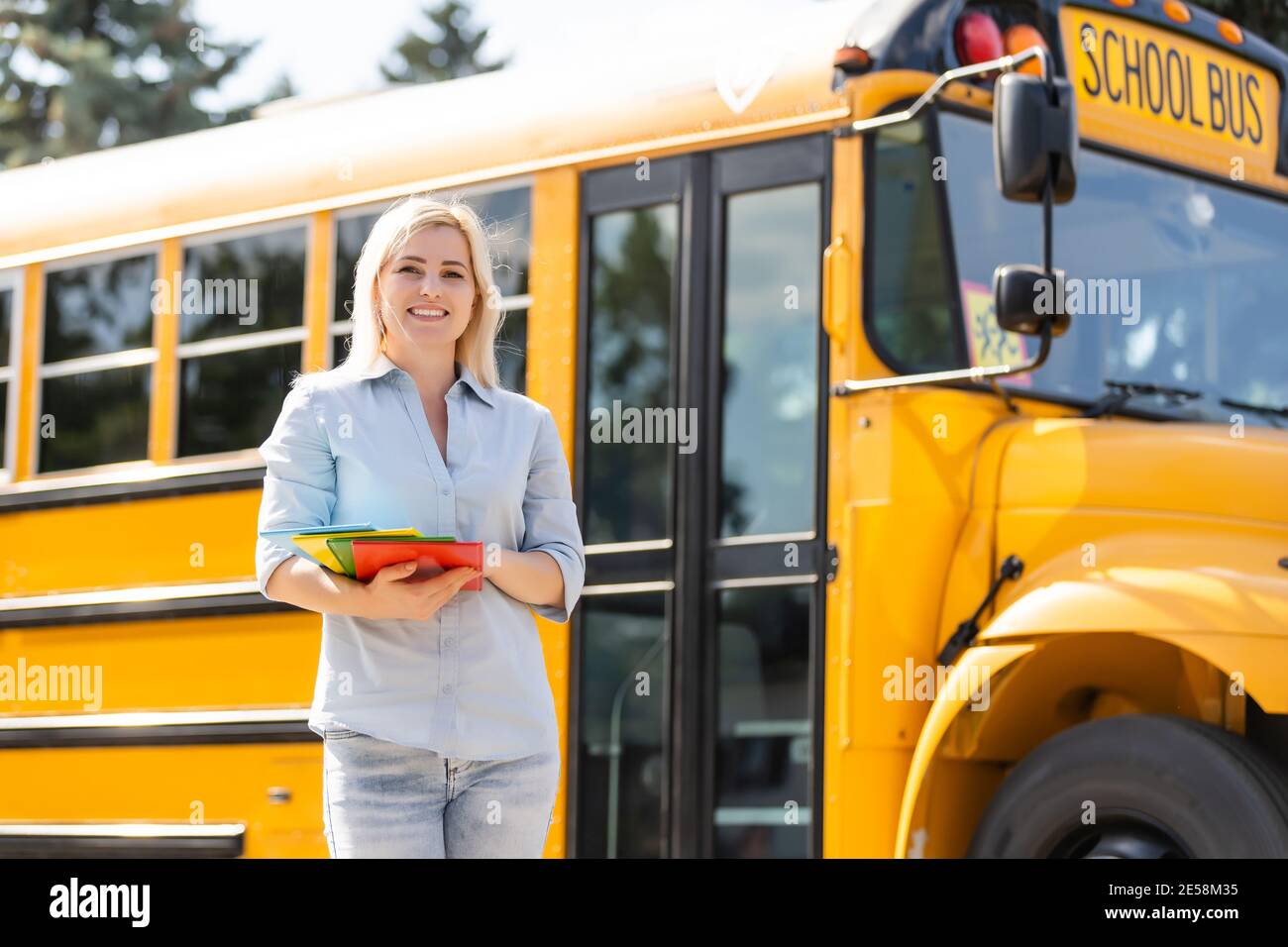 Children talking school bus hi-res stock photography and images - Alamy