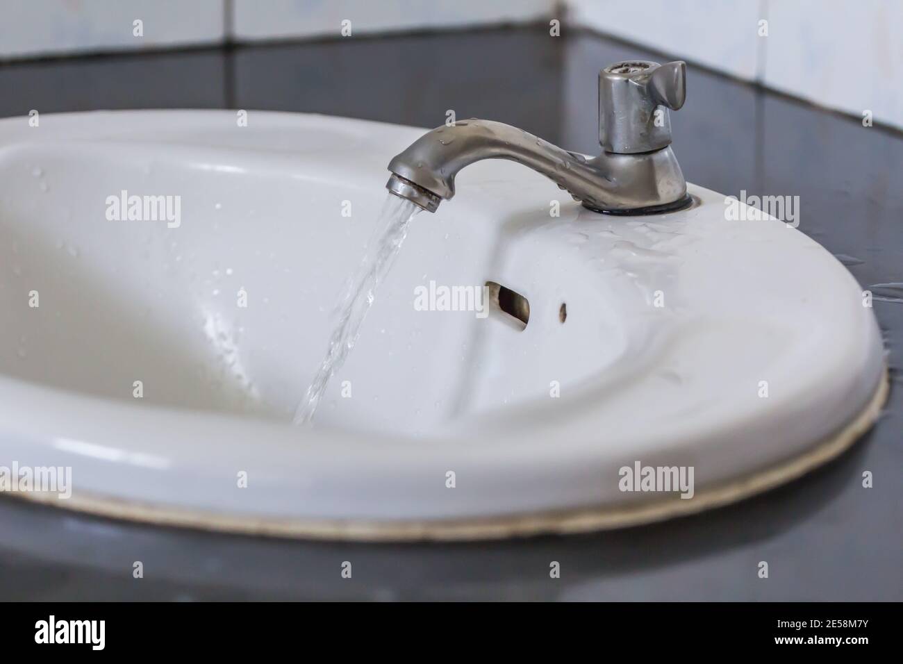 water tap in the restroom. Flowing water out Stock Photo - Alamy