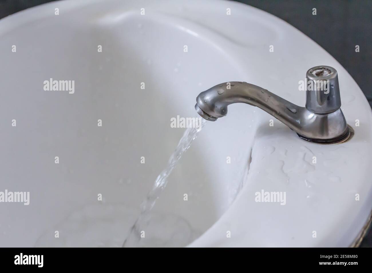 water tap in the restroom. Flowing water out Stock Photo - Alamy