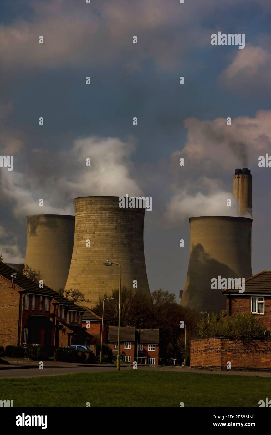 Power Station emitting pollution over modern a local housing estate ...